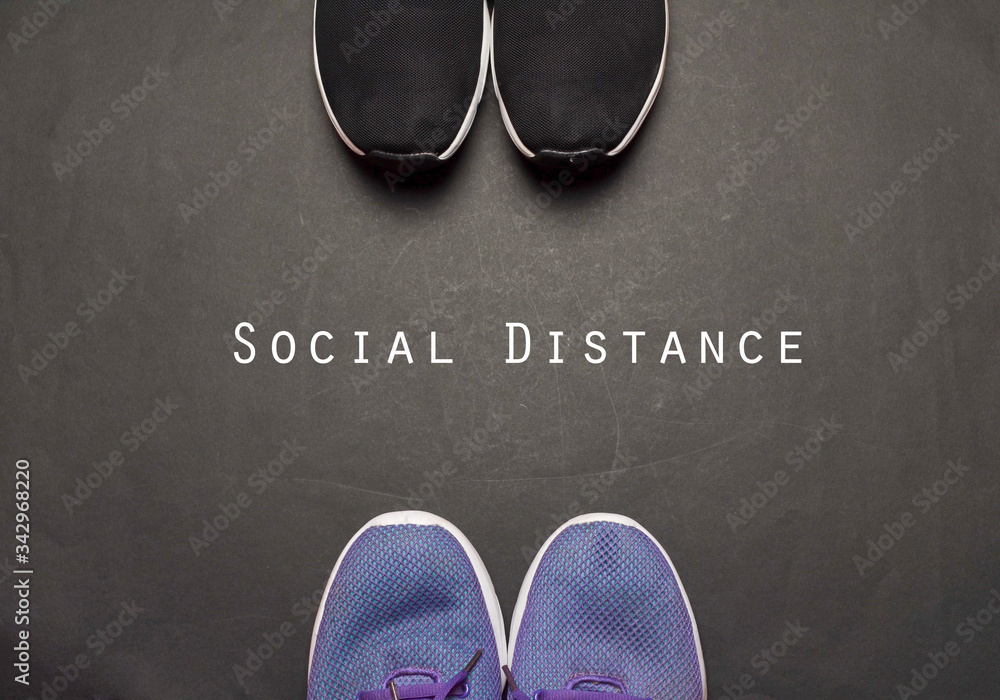 Social distancing concept. Shoes with text Social Distance. This image ...