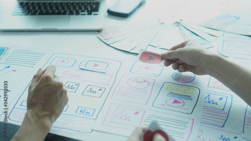 Designers man drawing ui/ux designers working and designing user ...