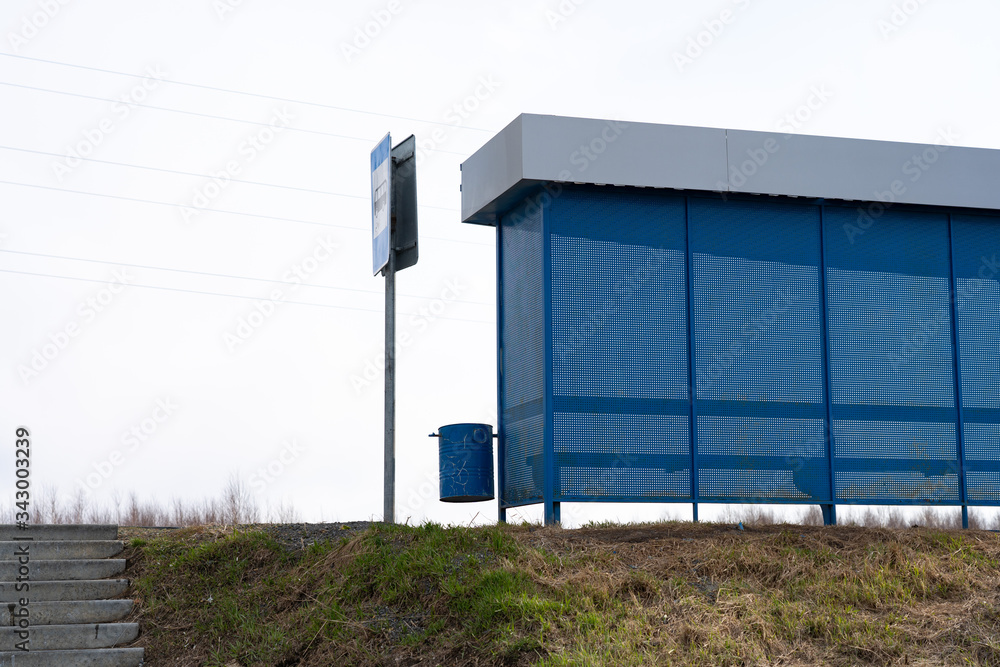 Stop the suburban bus. Modern steel roadside bus stop with seat ...