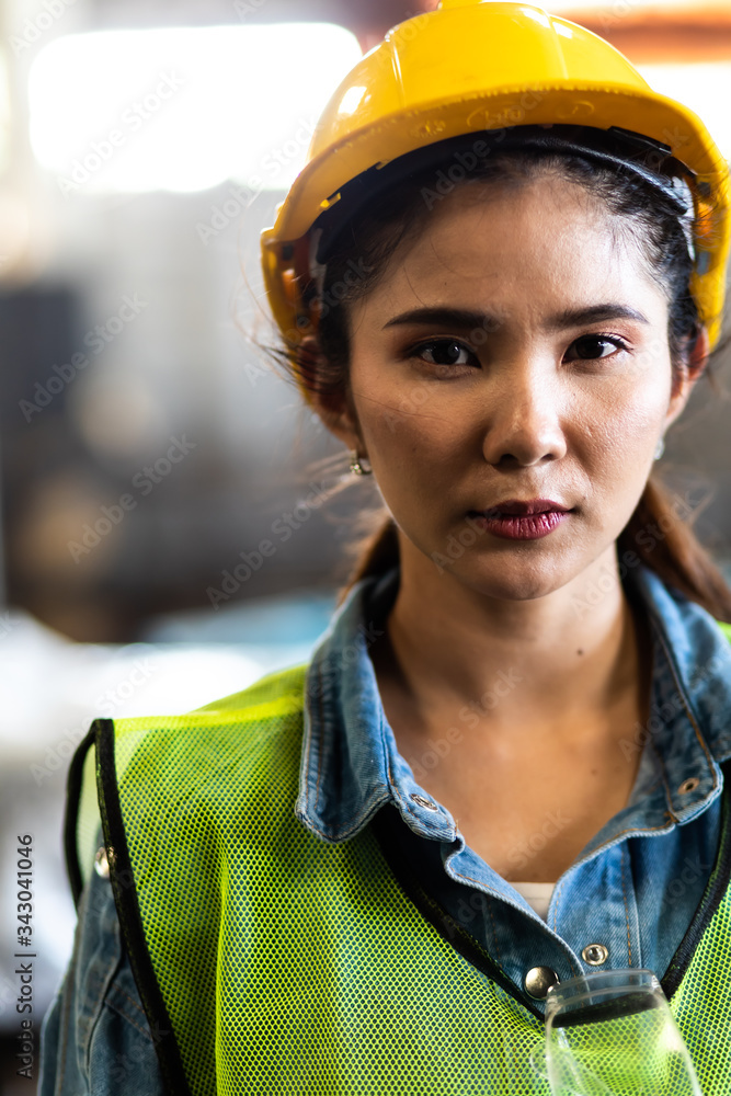 Portrait of beautiful Asian woman serious civil engineer wearing ...
