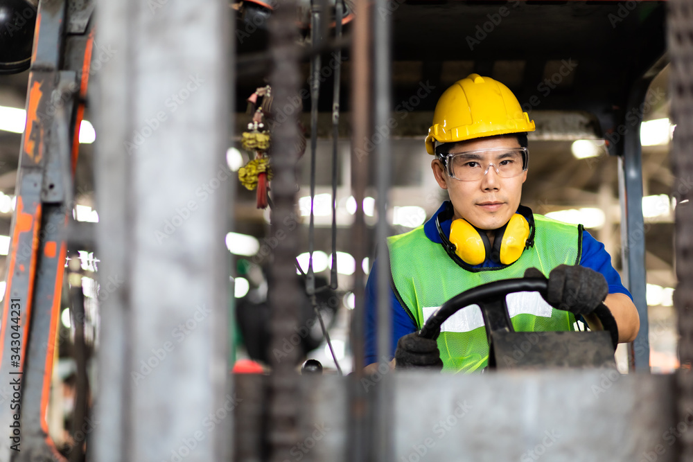 Man at work. Professional operation engineering. Young worker forklift ...