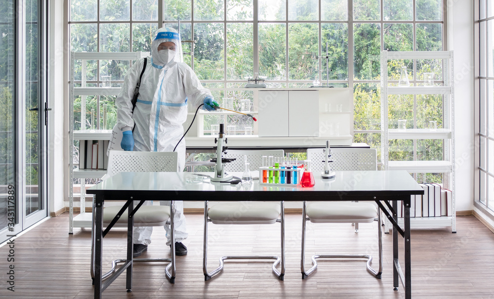 Asian man wear personal protective suits or PPE, goggle, and face mask ...