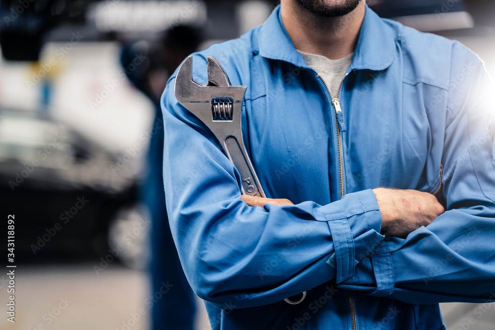 No face shot of car mechanic male worker holding equipment tool ...