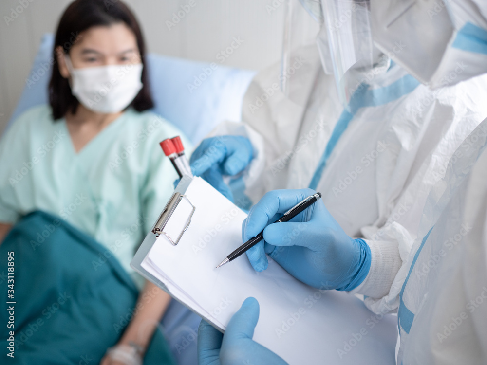 Two asian doctor wear PPE suit with N95 mask and face shield, hold ...