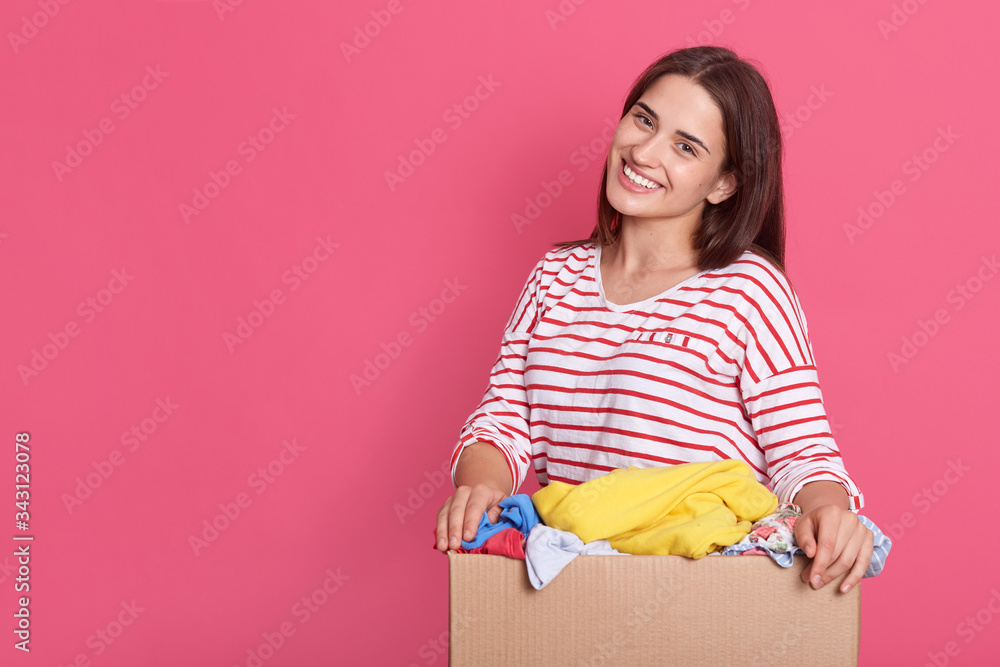 Foto de Image of brunette lady with pleasant appearance, standing with ...