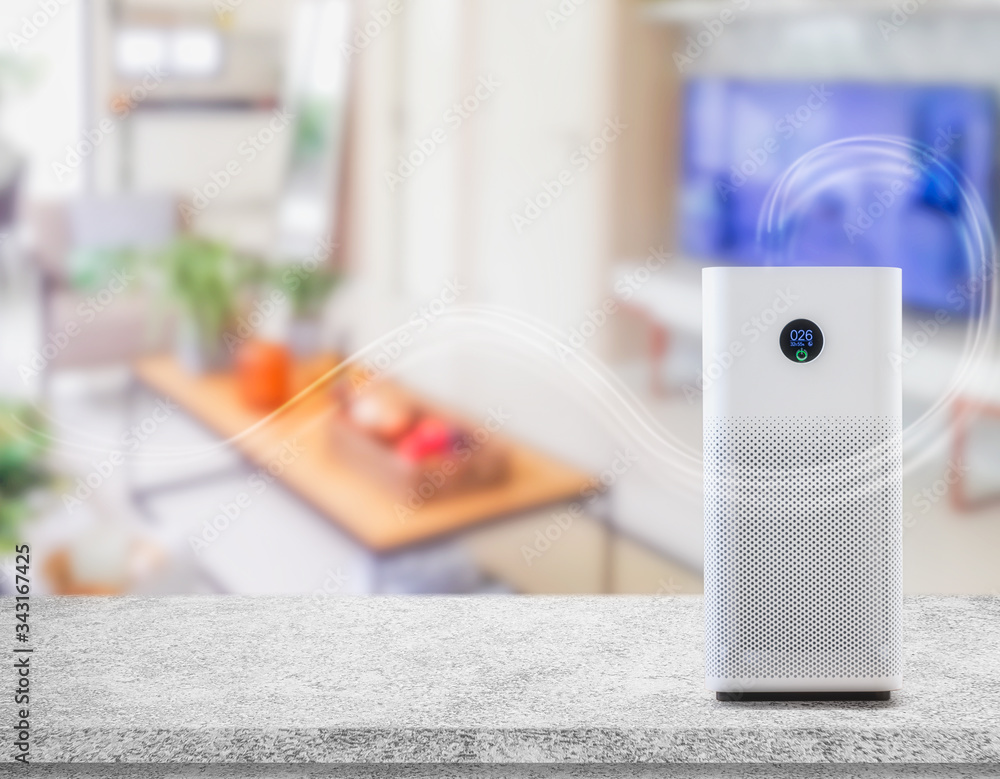 air purifier a living room, air cleaner removing fine dust in house ...