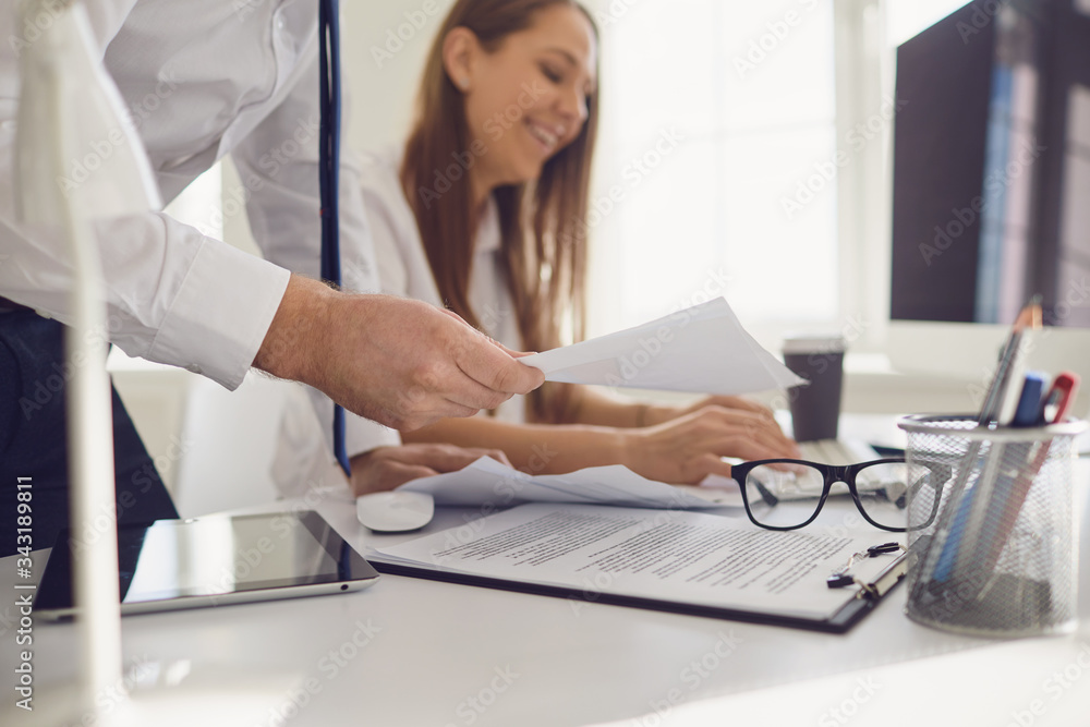 Faceless.Businessman and businesswoman working confident in a white ...