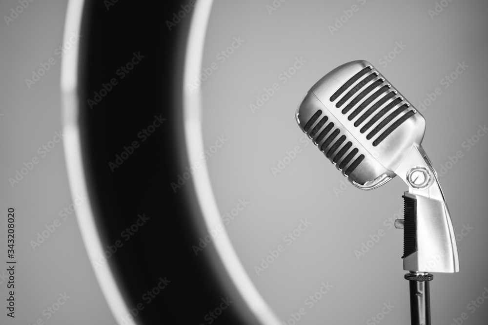 Detail of horizontal side view of old style metallic microphone inside ...