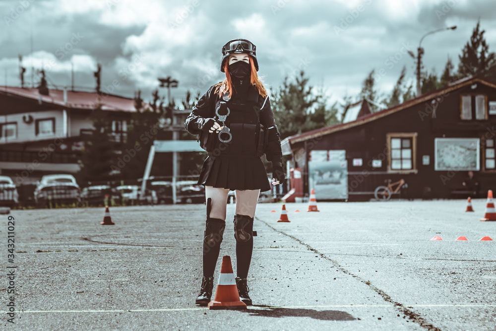 girl in black military uniform of a special forces detachment. Without ...