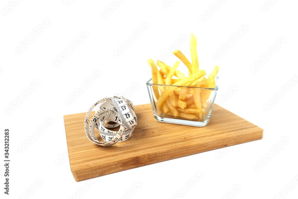French fries in a glass plate. Bamboo board. White background. Isolated ...
