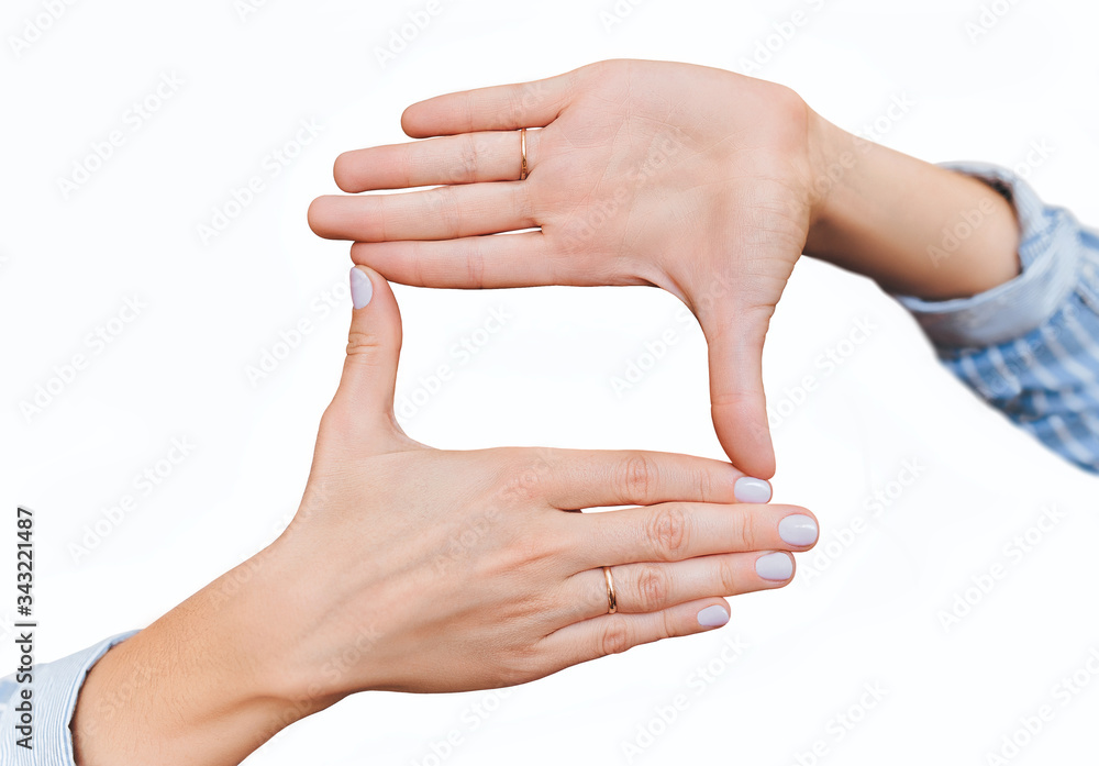 Female hands are planning a focus in the frame. Focal crop composition ...