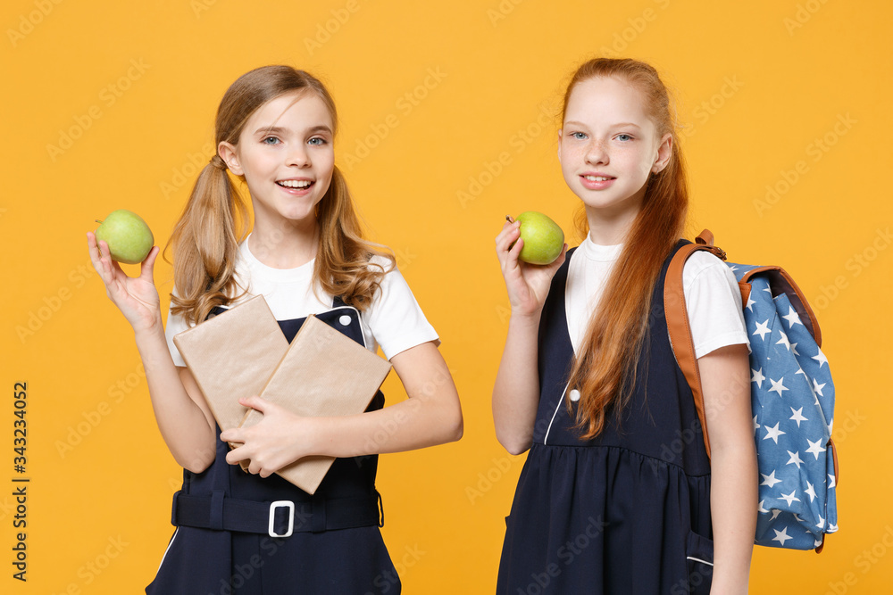 Girls 12-13 years old in white t-shirt blue school uniform dresses hold ...