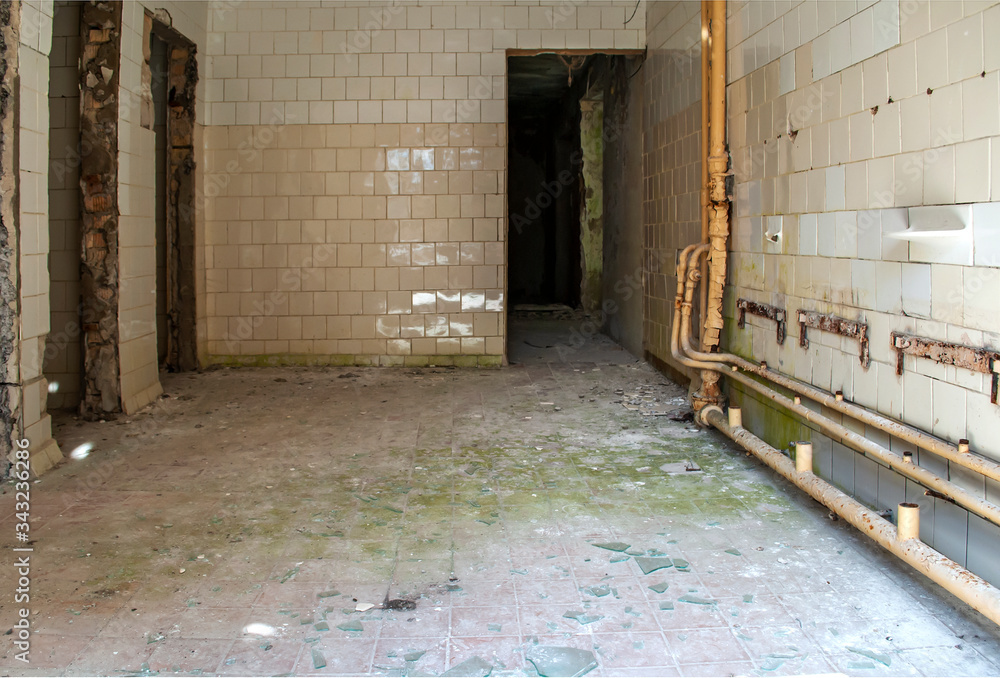 Old abandoned building, empty broken laundry room, utility room. Life ...