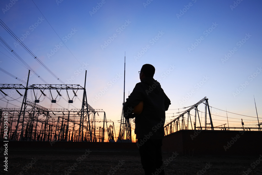 Electricity workers and pylon silhouette, Power workers at work Stock ...