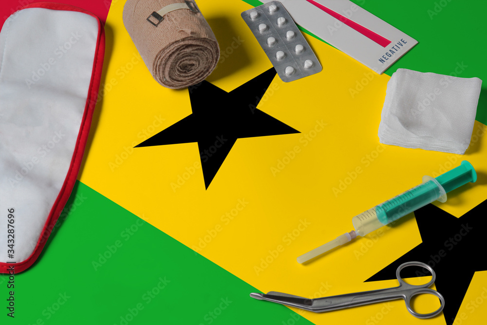 Sao Tome And Principe flag with first aid medical kit on wooden table ...