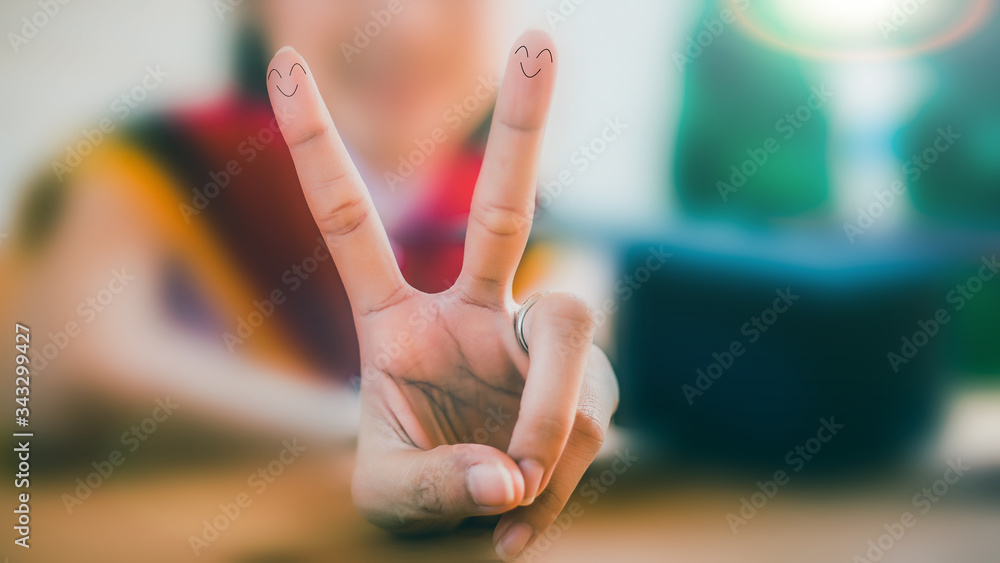 The index finger and middle finger with a smile. Symbol of ...