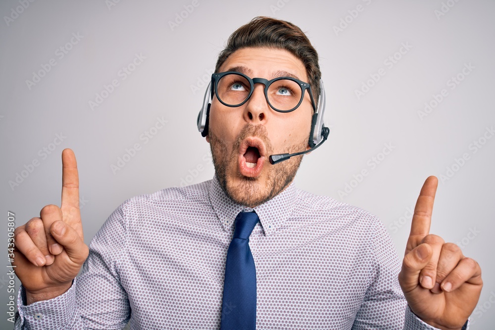 Young call center operator business man with blue eyes wearing glasses ...