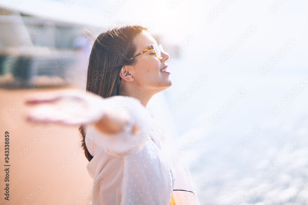 Young beautiful woman on vacation smiling happy and confident. Standing ...