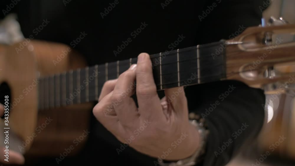 Another chords. String Cuatro instrument recording session, closeup ...