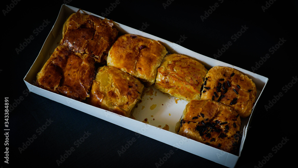 Packed banana bolen and plates. Stock Photo | Adobe Stock