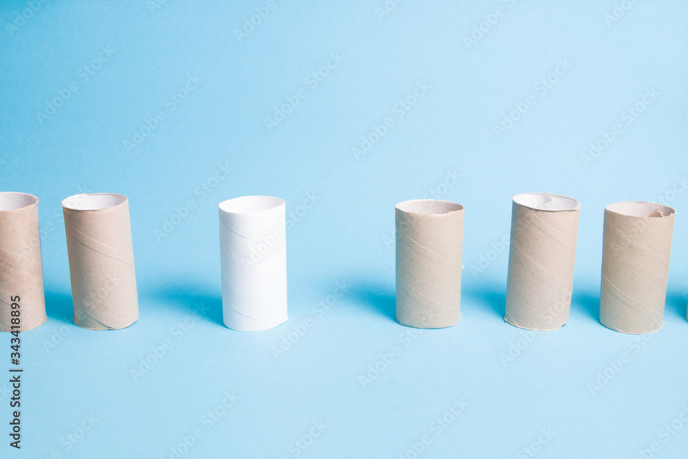 hubs from toilet paper stand in a row, social distance concept, blue ...