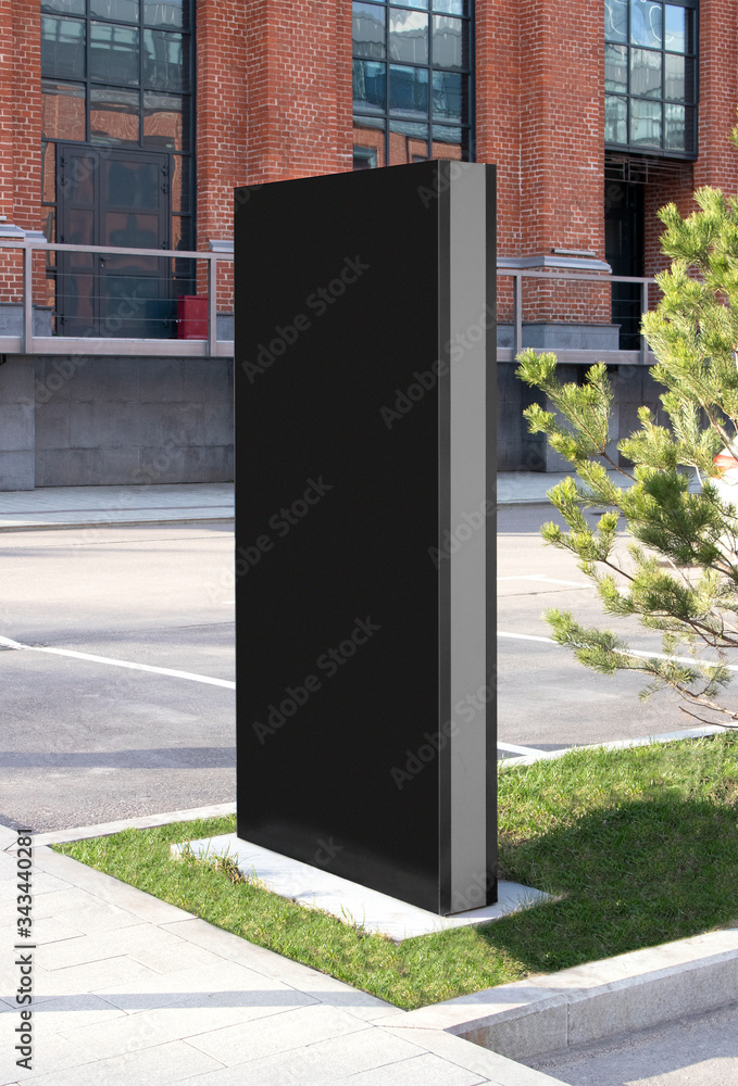 Blank black vertical pylon stand mockup brick building, side view Stock ...