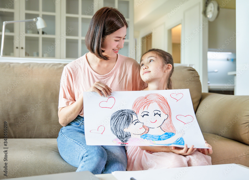 little girl showing Color pencil drawing family picture to her mother ...
