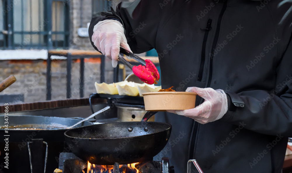 Professional chef and fire. Cooking vegetables and food Stock Photo ...