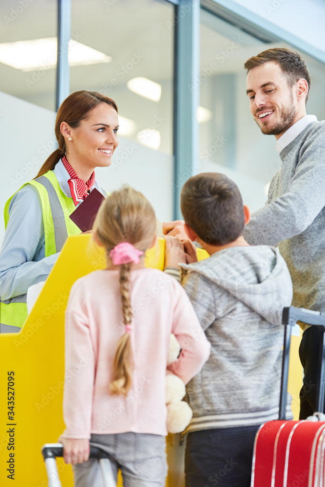 Father and children at the check in counter in the airport Stock Photo ...