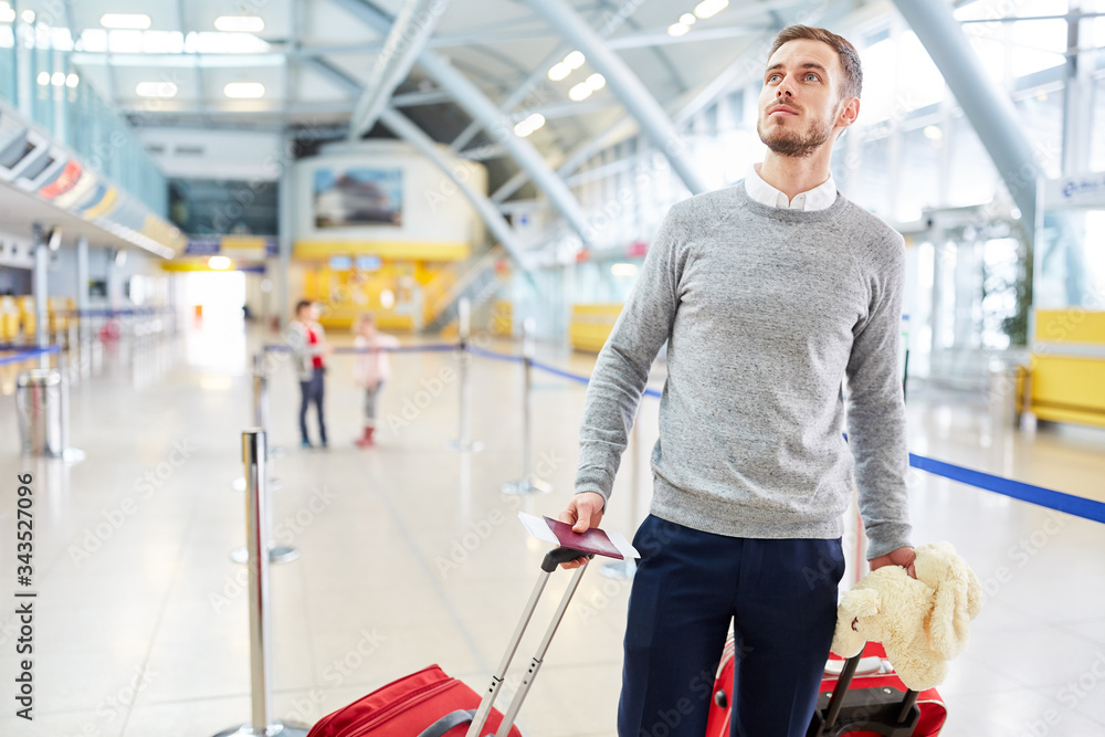 Man in the airport. Terminal is looking for connecting flight Stock ...