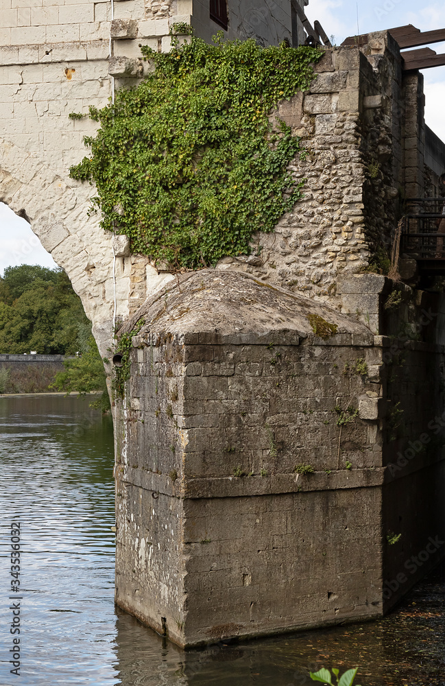 elements of an ancient cobblestone bridge over a river Stock Photo ...