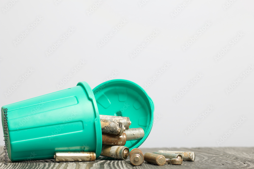 Trash can with a lid, capsized on its side. Tank filled with waste ...