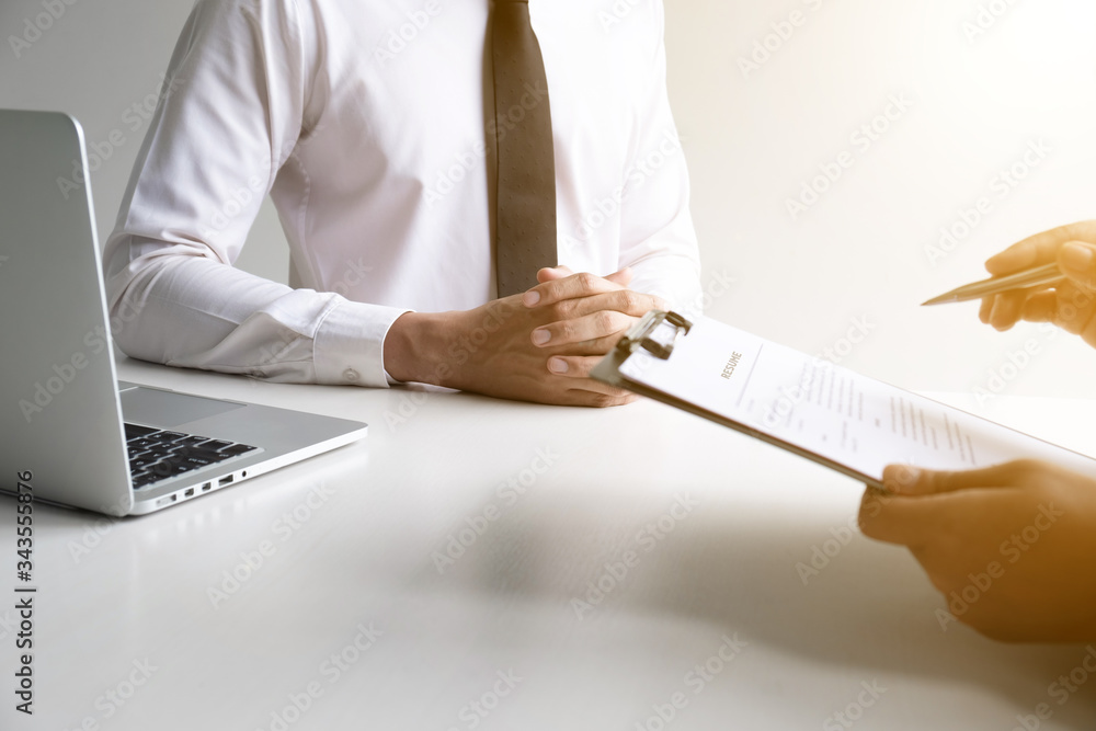 Interview employee is reading and checking a resume with a job ...