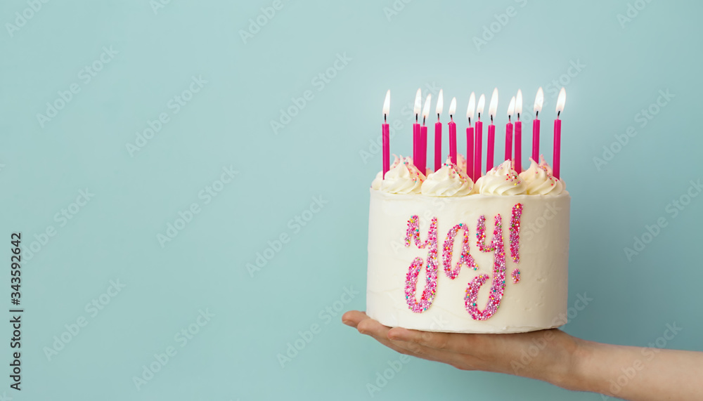 Hand holding birthday cake Stock Photo | Adobe Stock
