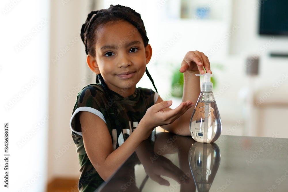 Black African American children using antibacterial antiseptic hand ...