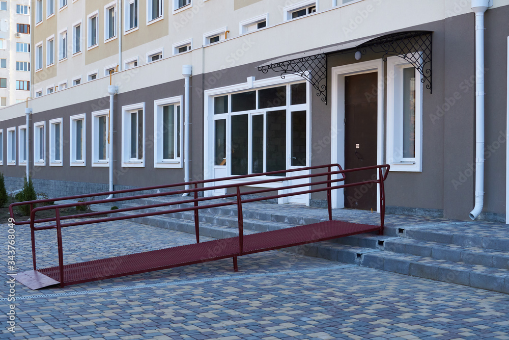 Wheelchair access ramp for entrance of residential multistory building ...