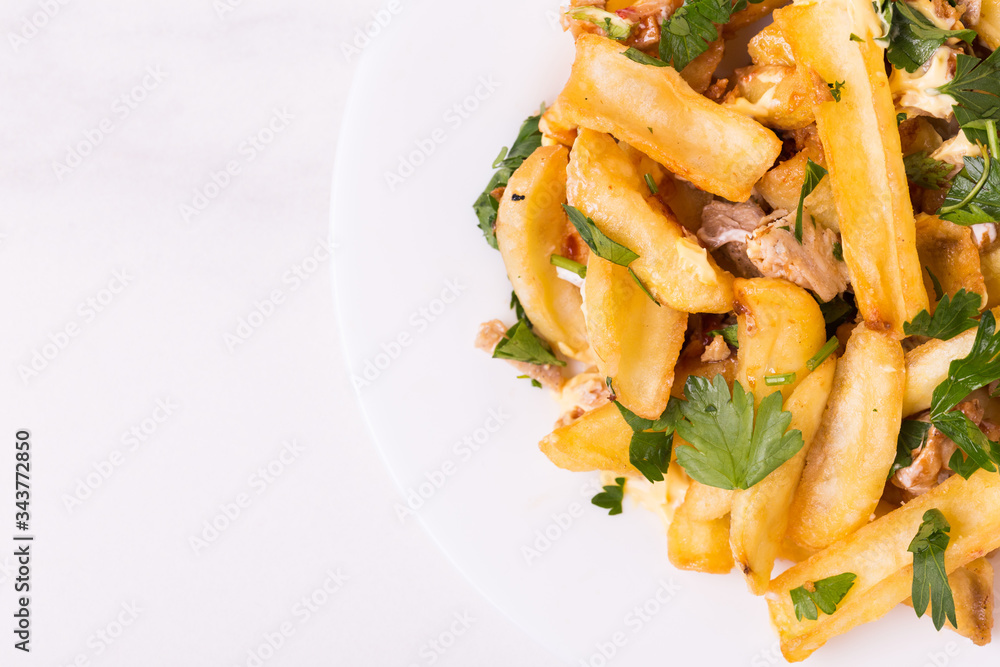 Canadian poutine french fries with brown gravy sauce, chicken and ...