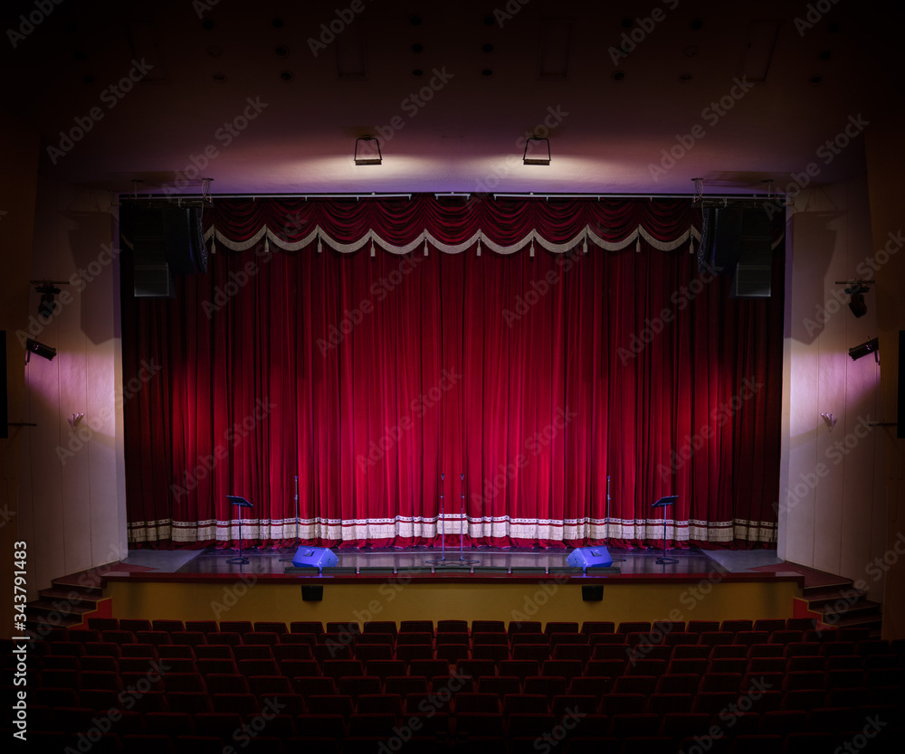Theatrical dark red velvet curtain with golden fringe. Texture ...