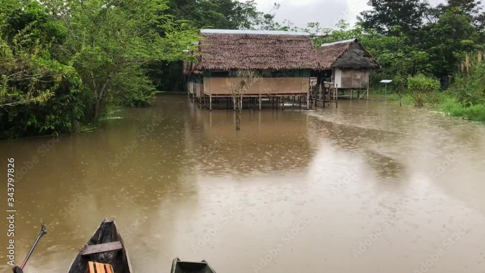 View of a lodege in the middle of the amazon jungle during a rainy day ...