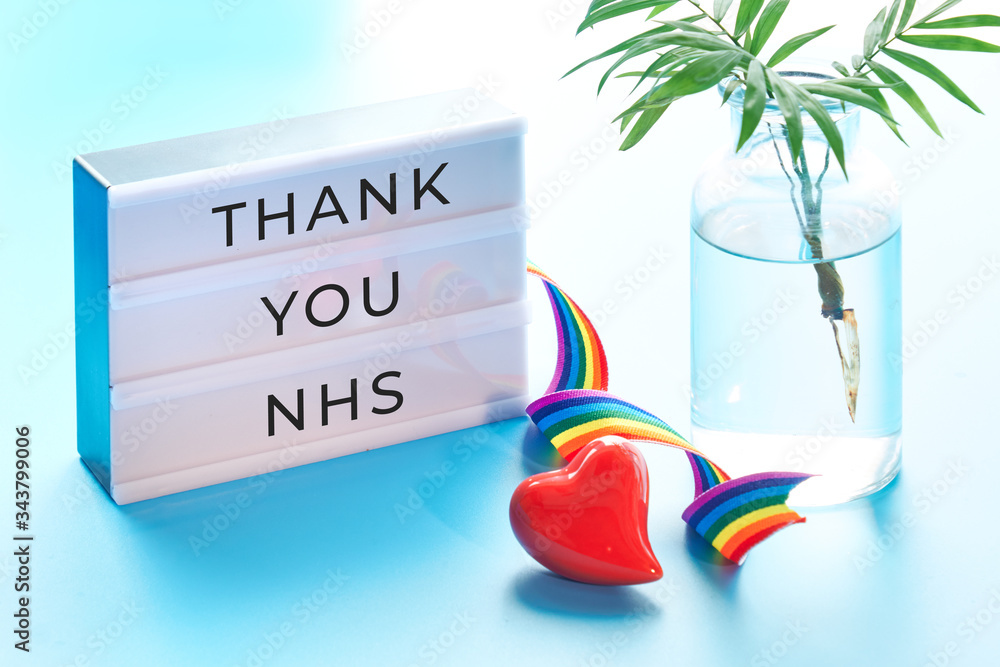 Lightbox with text "Thank you NHS", bottle with palm leaf. Heart ...