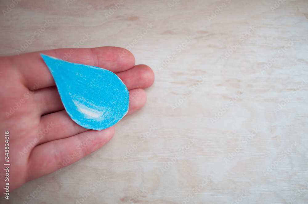 hand holds a drop of water, World Hand Hygiene Day. World Water Day ...