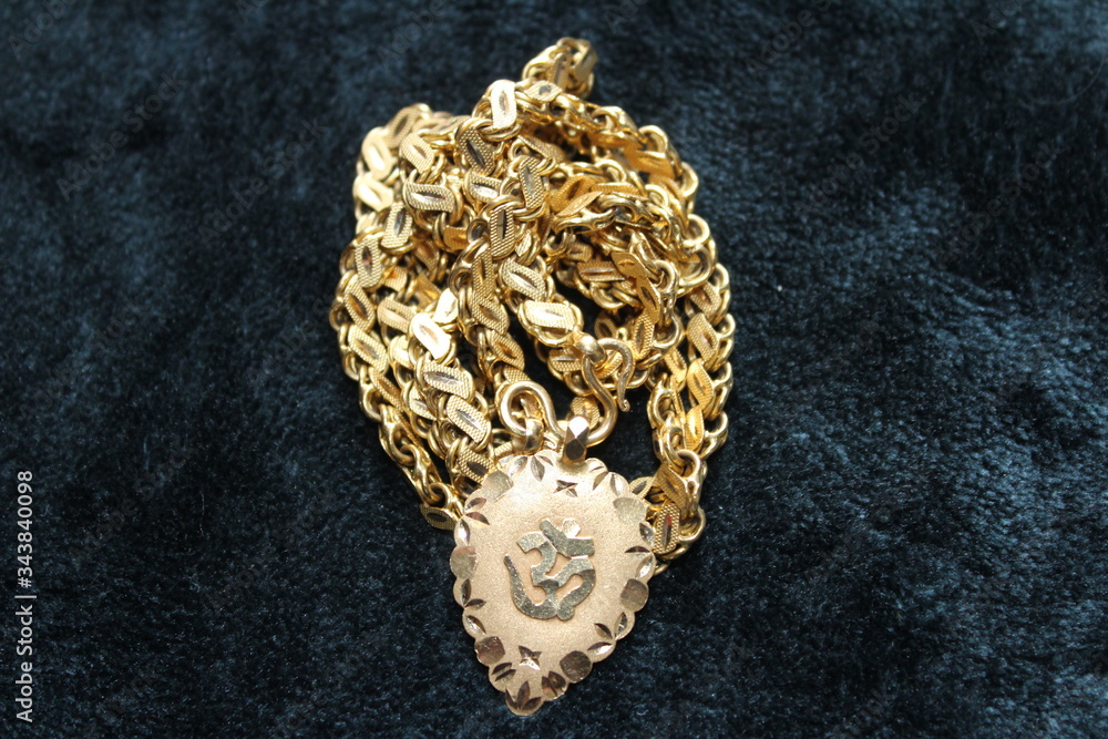 Kerala hindu wedding chain isolated on background color. Stock Photo ...