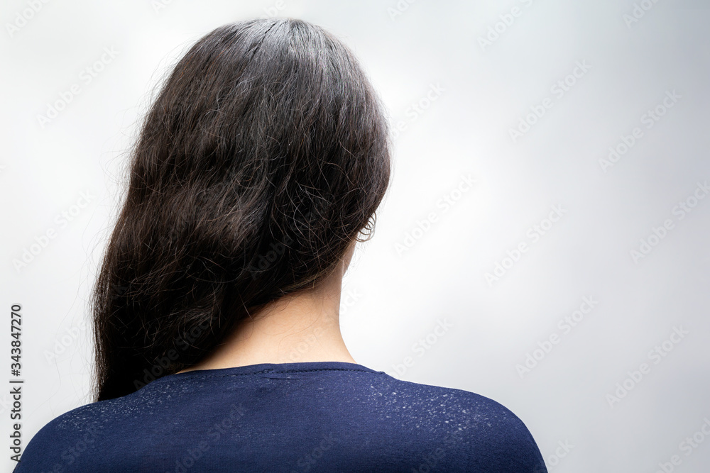 The woman is a brunette with her hair pulled back to one side, and her ...