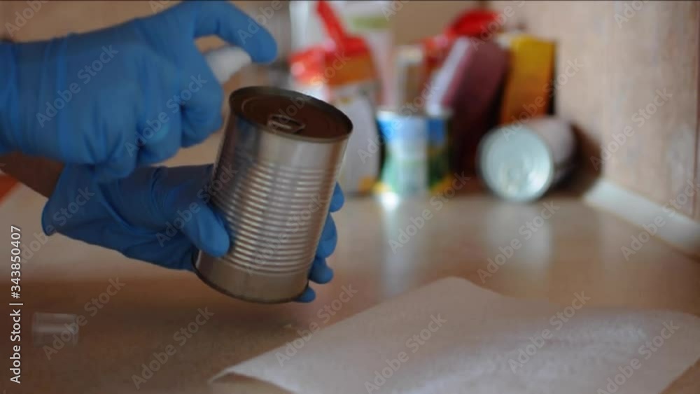 Woman clean the can after receiving product from shop online. Food home ...