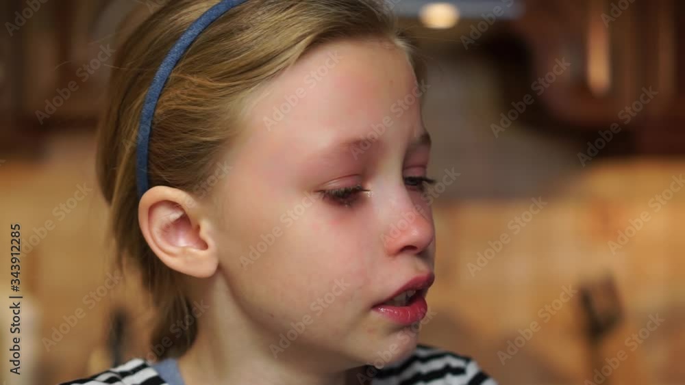 Blond beautiful child girl in striped dress crying badly tears drop ...