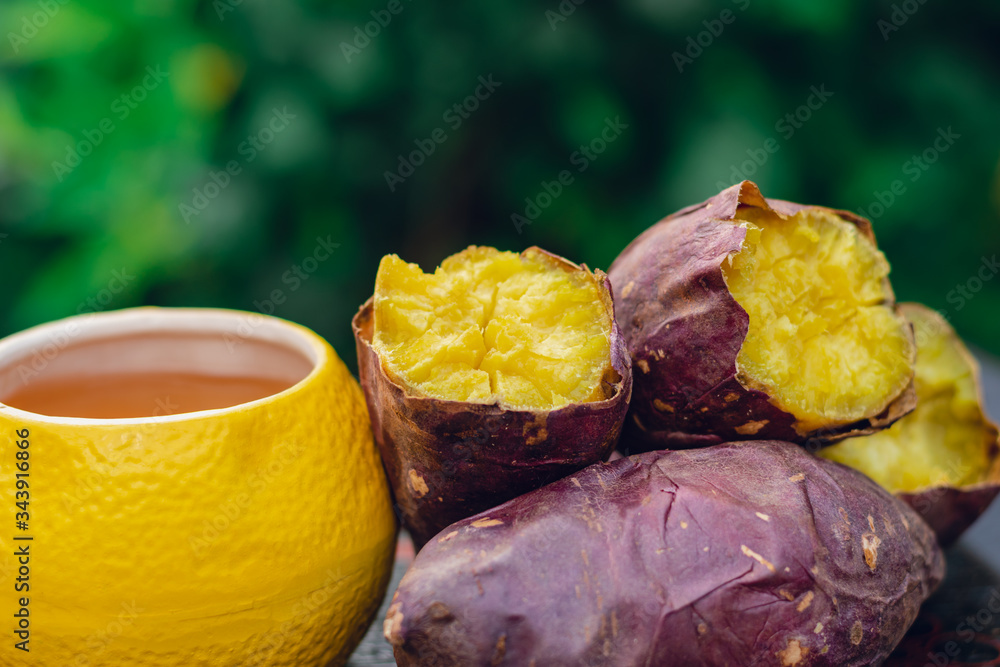 The yellow tea cup has a fragrant tea and Japanese sweet potato, Green ...
