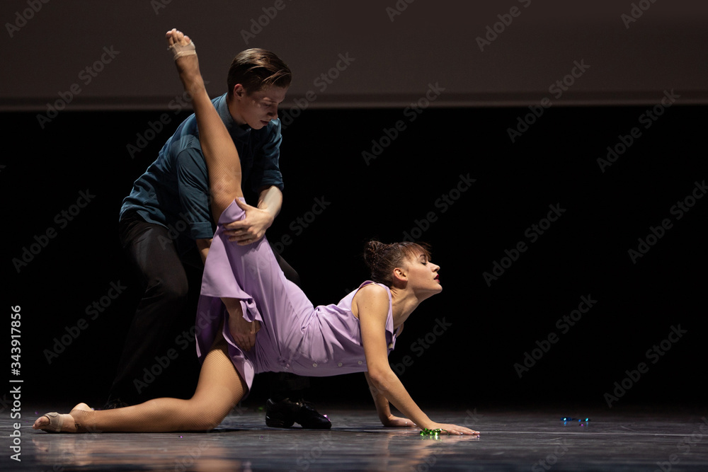 dancers a man and a woman perform in a theater on stage in a dance ...