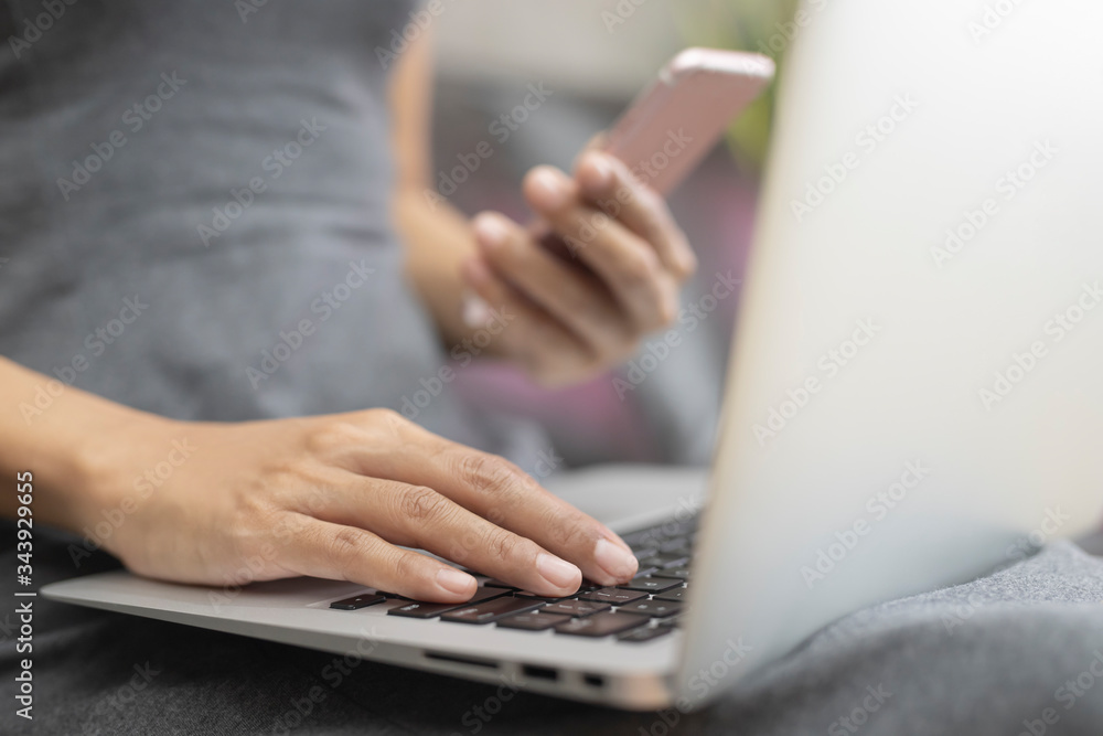Working woman is working with a smart phone and computer. The concept ...