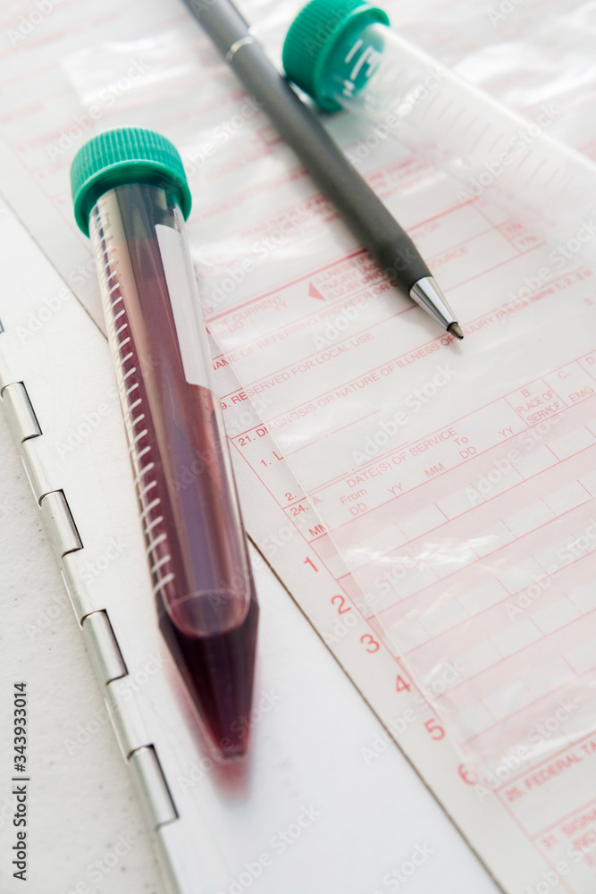 Blood sample with medical documents Stock Photo | Adobe Stock