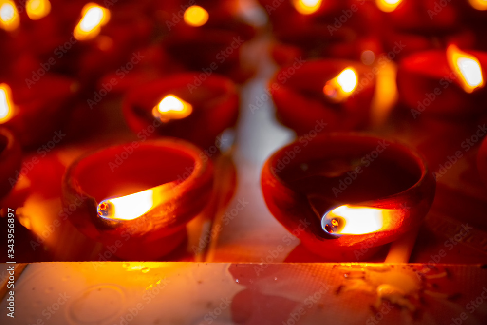 Numerous Clay oil lamps are burning. Traditional festival of oil lamp ...